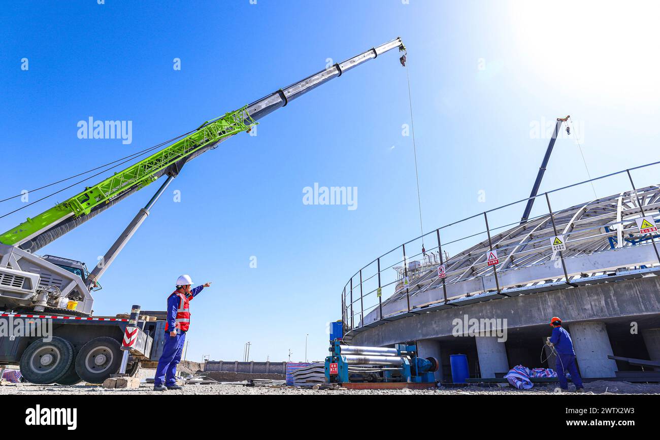 ZHANGYE, CHINA - MARCH 19, 2024 - Builders are lifting the steel ...