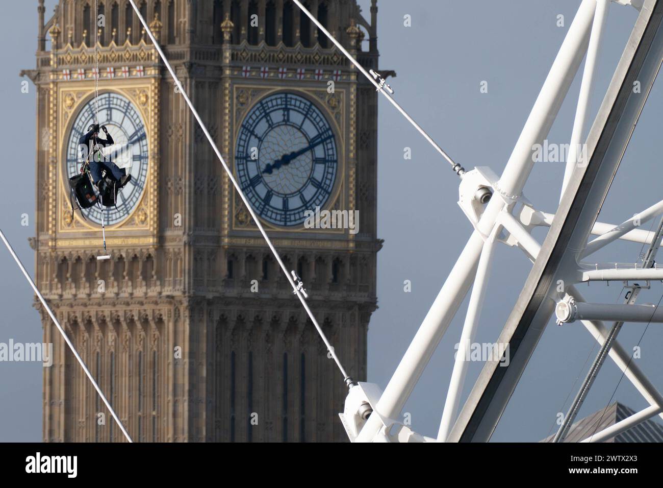 A painting crew abseil down from the top of the lastminute.com London ...