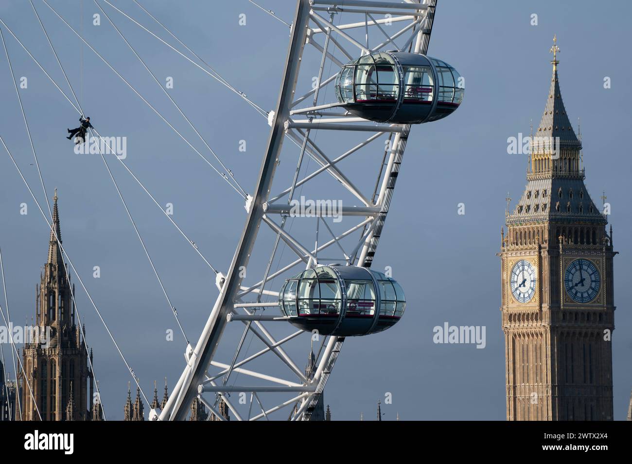 A painting crew abseil down from the top of the lastminute.com London ...