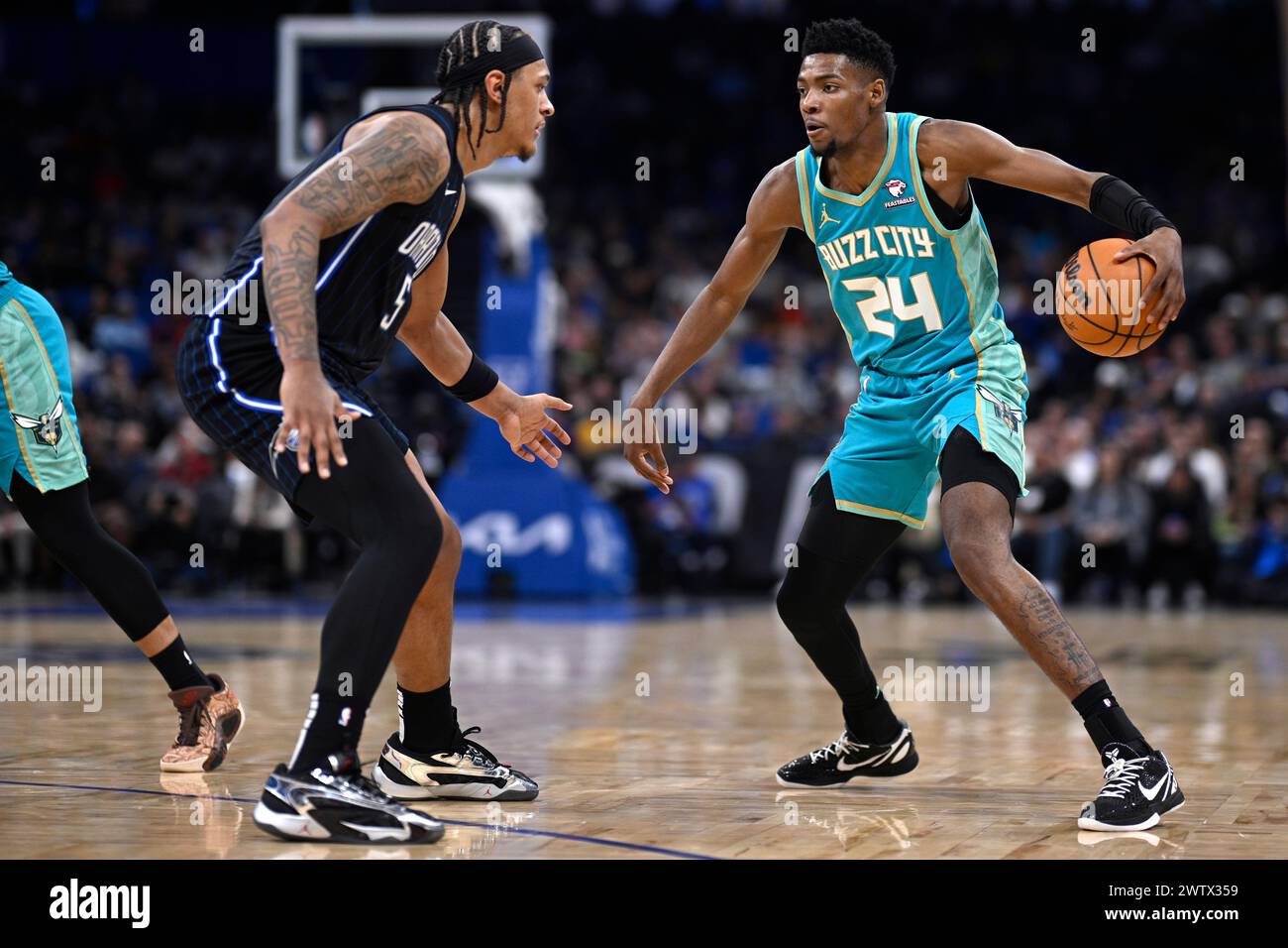 Charlotte Hornets forward Brandon Miller (24) is defended by Orlando ...