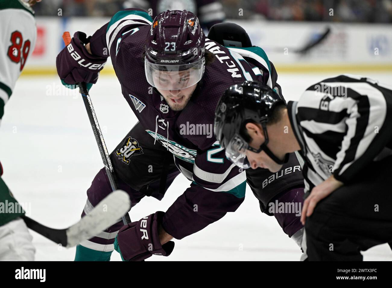 Anaheim Ducks center Mason McTavish (23) faces off against Minnesota ...