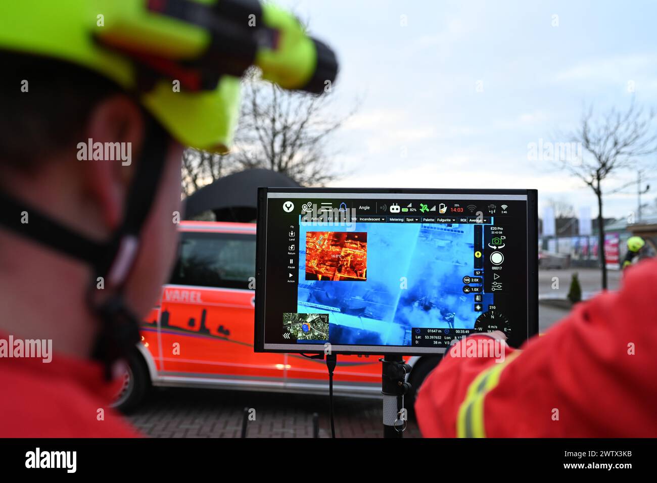 Varel, Germany. 20th Mar, 2024. Two emergency crews view aerial photos ...