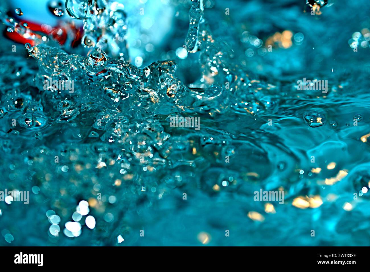 Falling drops created a storm on the surface of the water Stock Photo ...