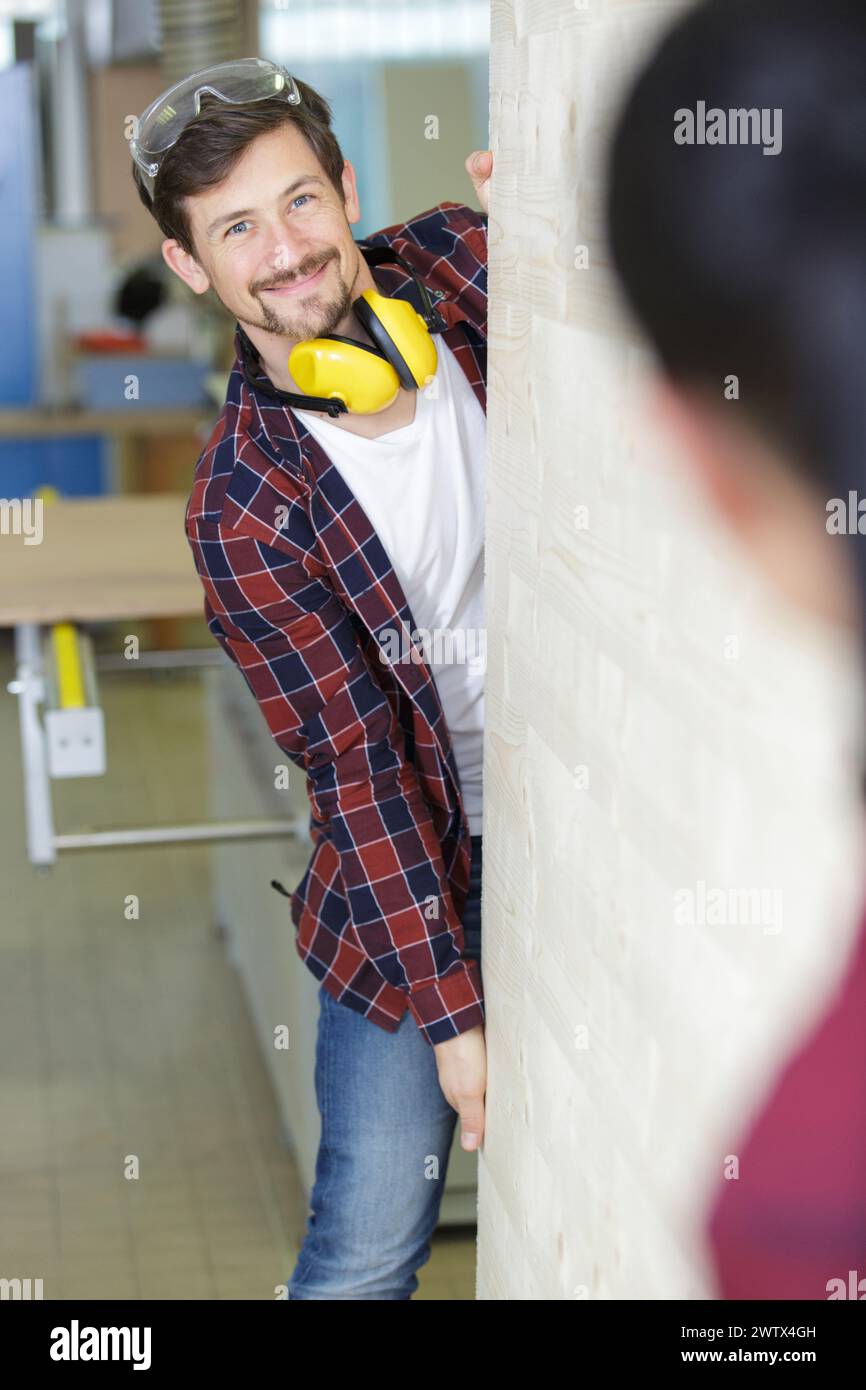 Female worker carrying board hi-res stock photography and images - Alamy