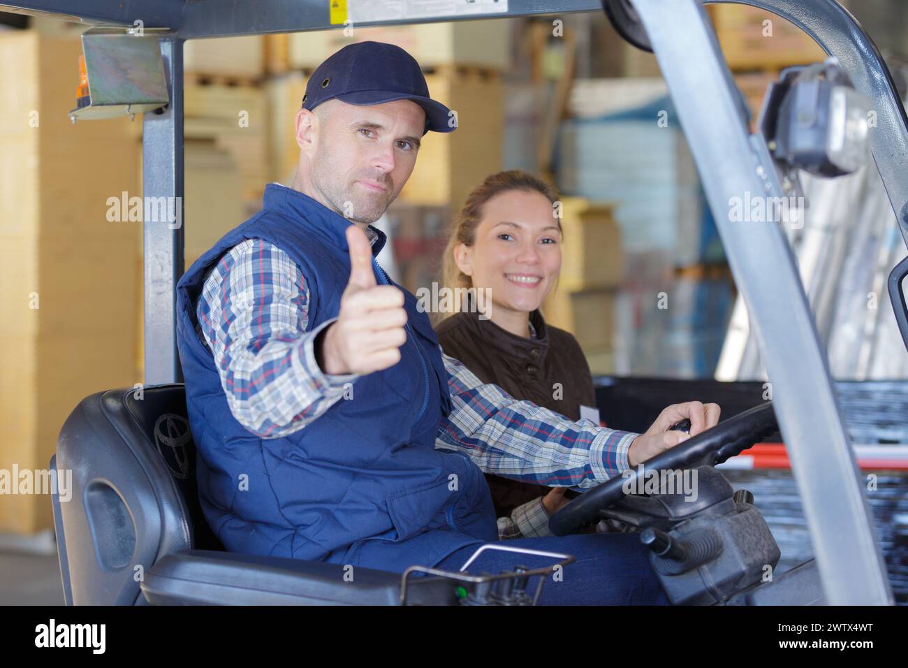 woman working with a forklift in a warehouse Stock Photo - Alamy