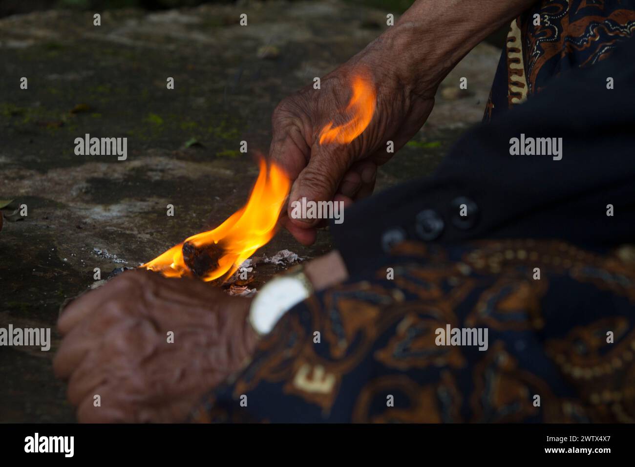 A traditional leader burns incense for a traditional ritual Stock Photo ...