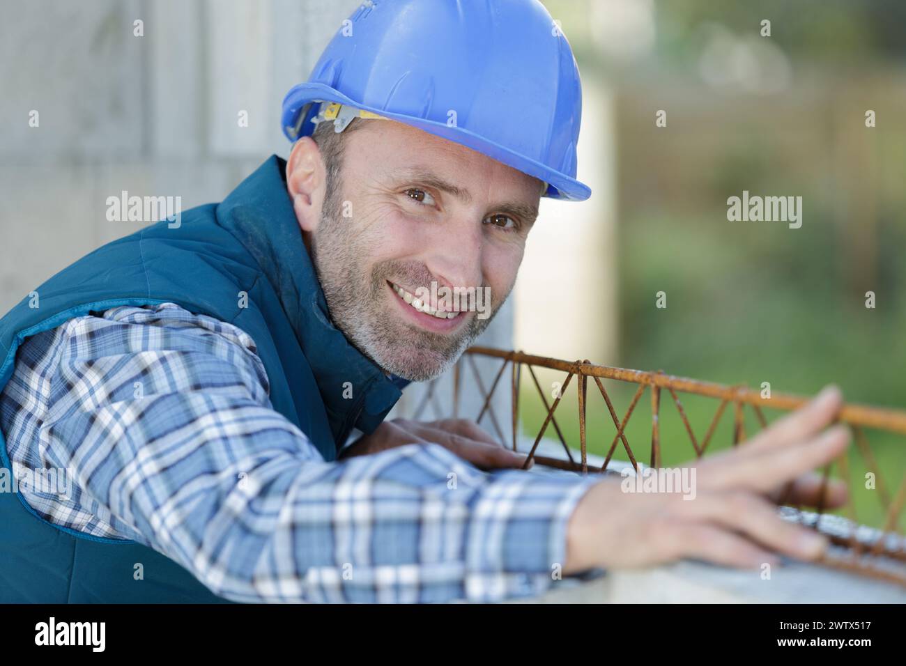 a smiling constructor in room Stock Photo - Alamy
