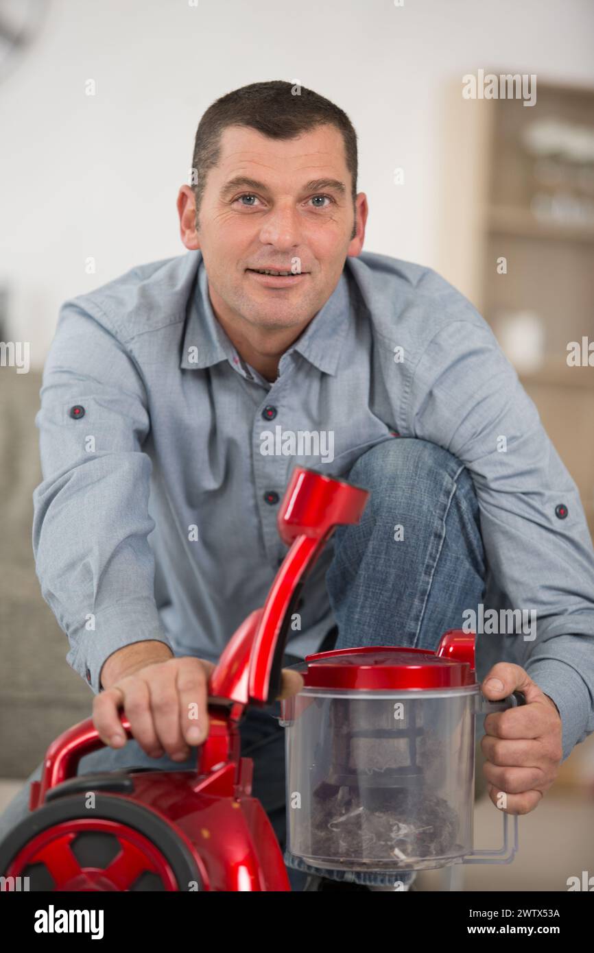 a mature man before hoovering Stock Photo - Alamy
