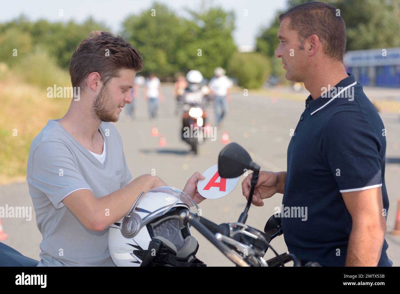 people and motorcycle driving lesson Stock Photo - Alamy
