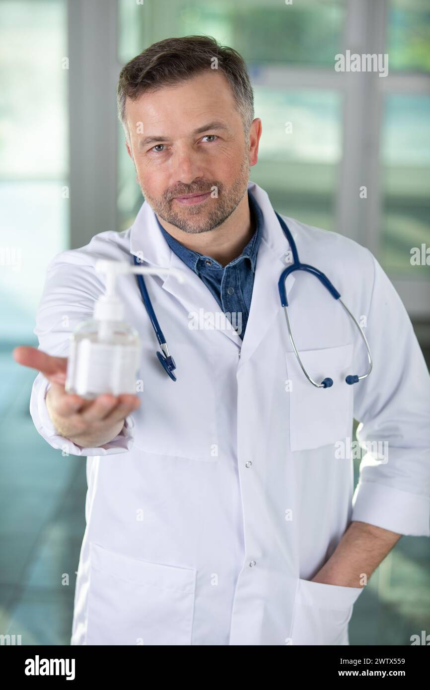 doctor surgeon holding the sanitizer gel Stock Photo - Alamy