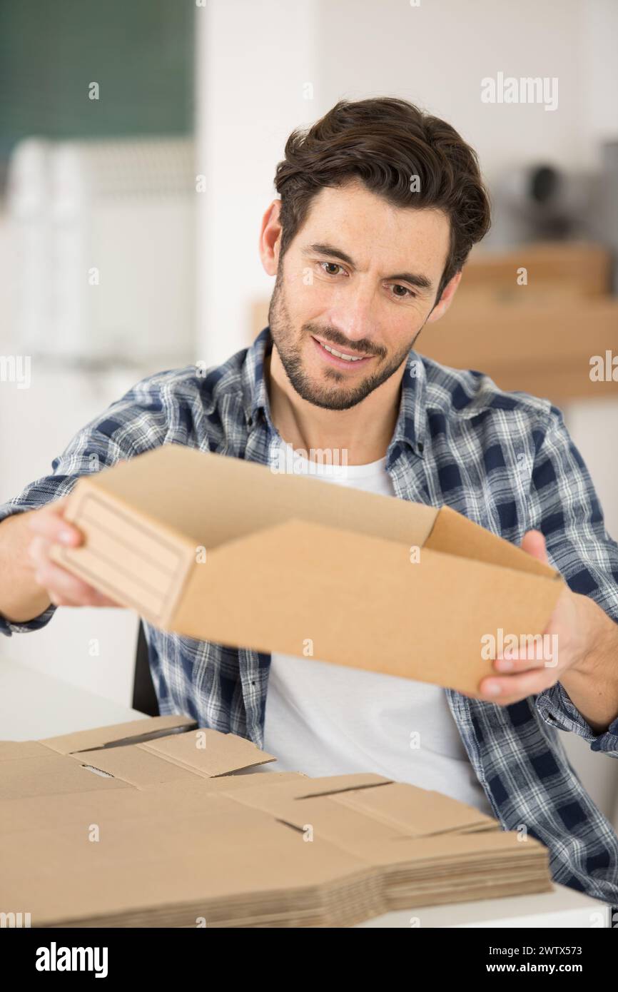 a business man making boxes Stock Photo - Alamy