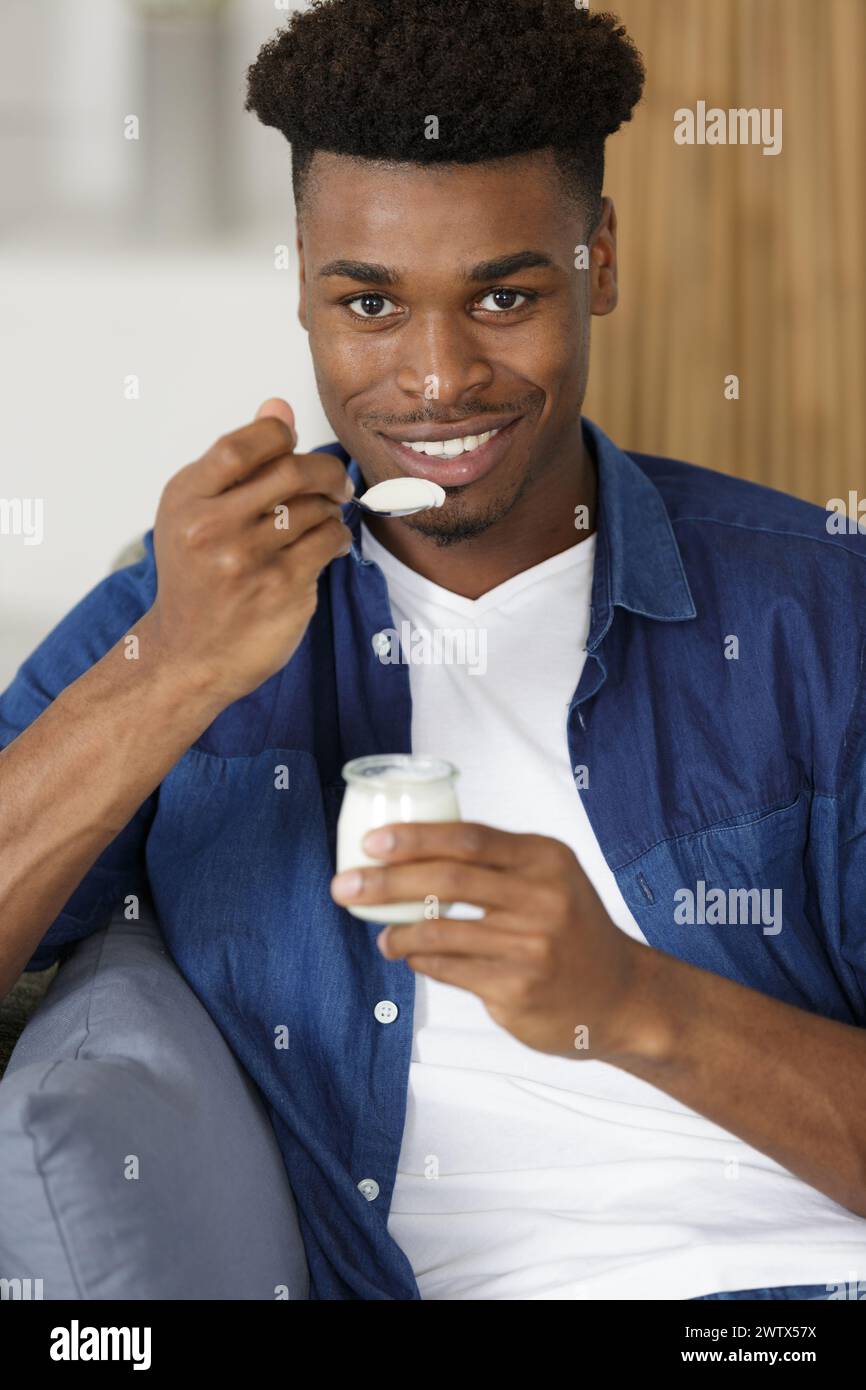 healthy eating young man yogurt Stock Photo - Alamy