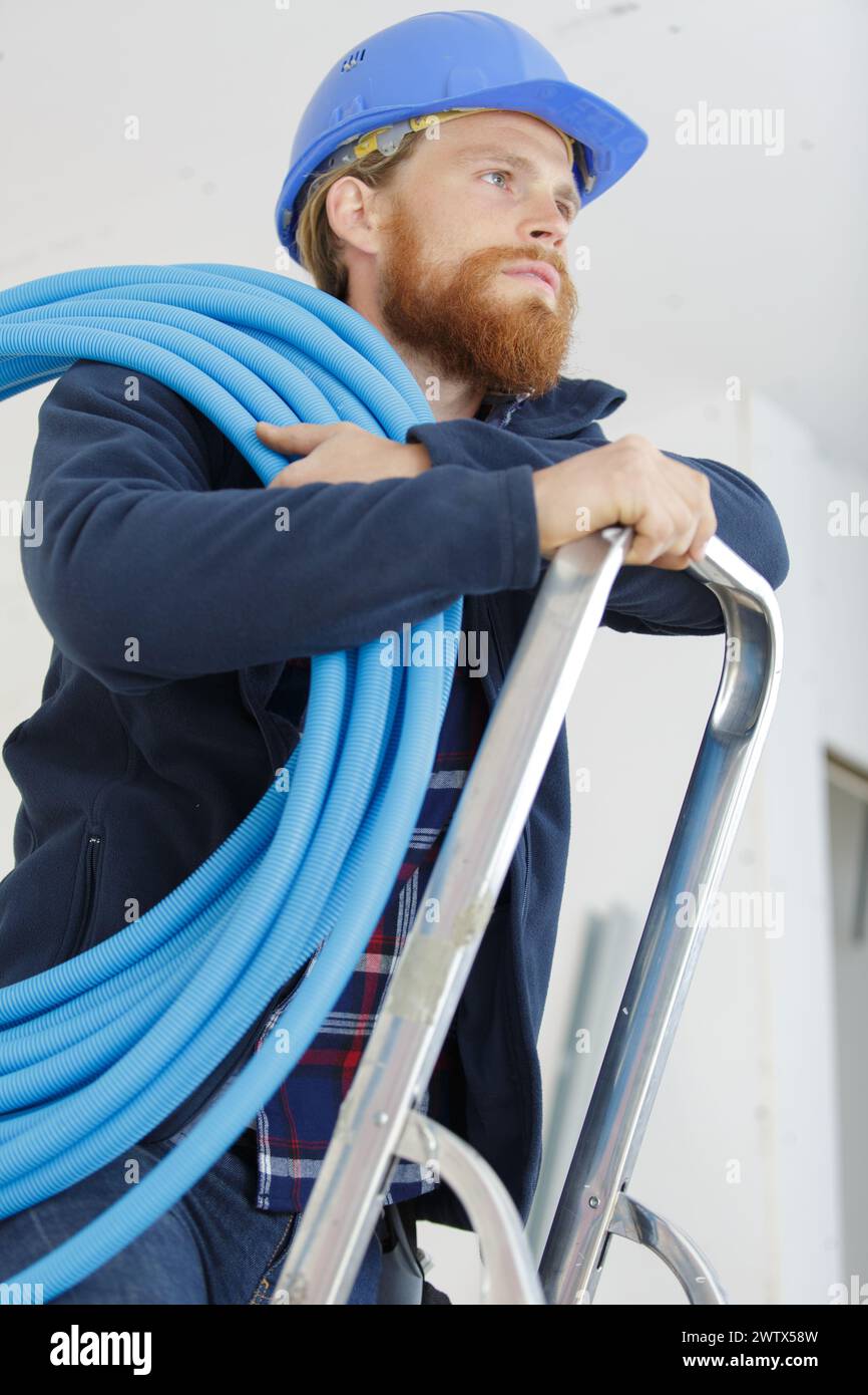 electrician at work with electrical cables Stock Photo - Alamy