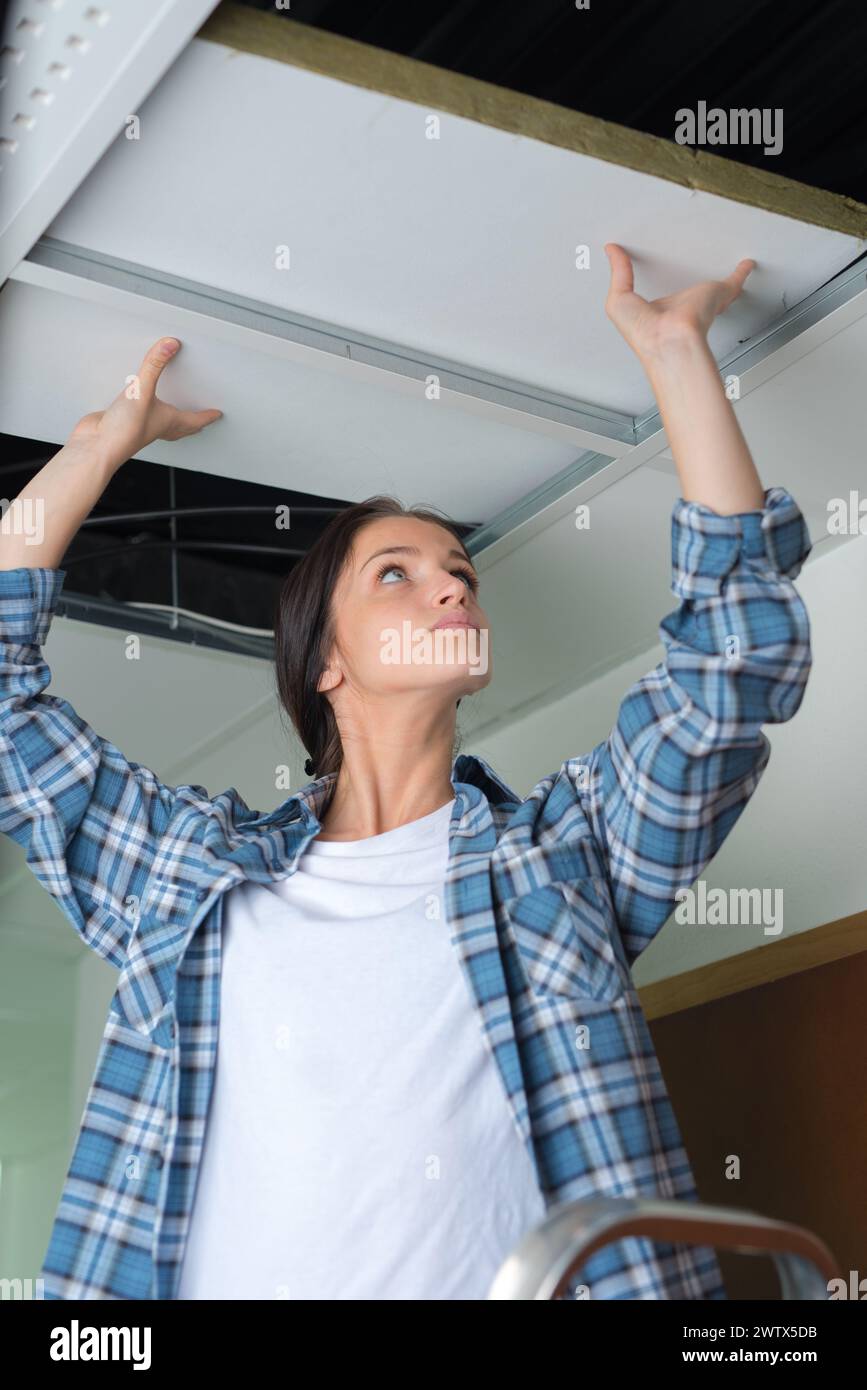 Female builder fixing electricity hi-res stock photography and images ...