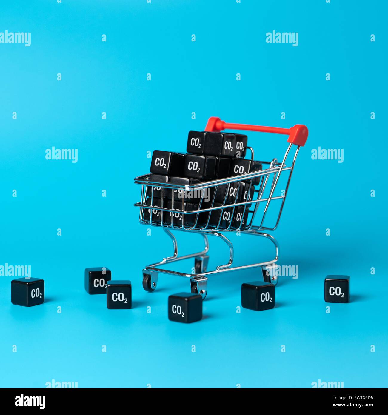 Shopping cart and CO2 carbon cubes. Greenhouse gas consumption and ...