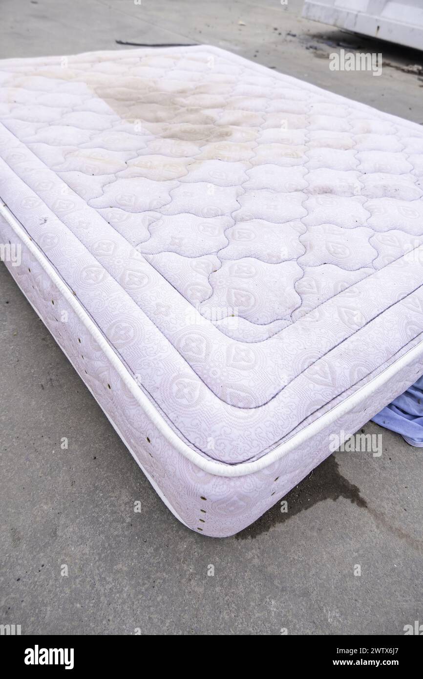 Detail of old damaged mattress thrown into the trash, recycling Stock ...