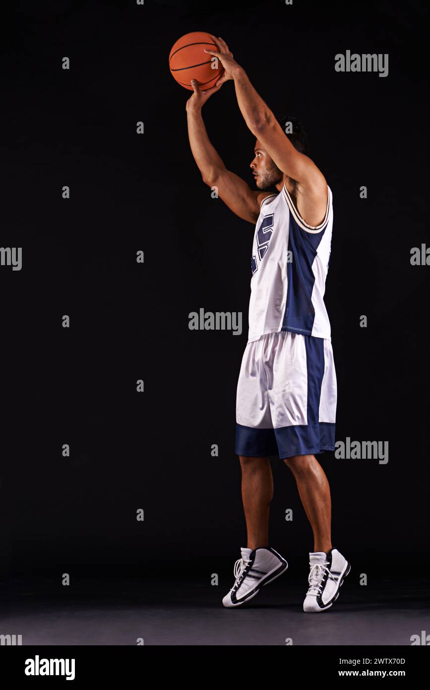 Man, shoot and basketball player in studio as athlete goals for workout ...