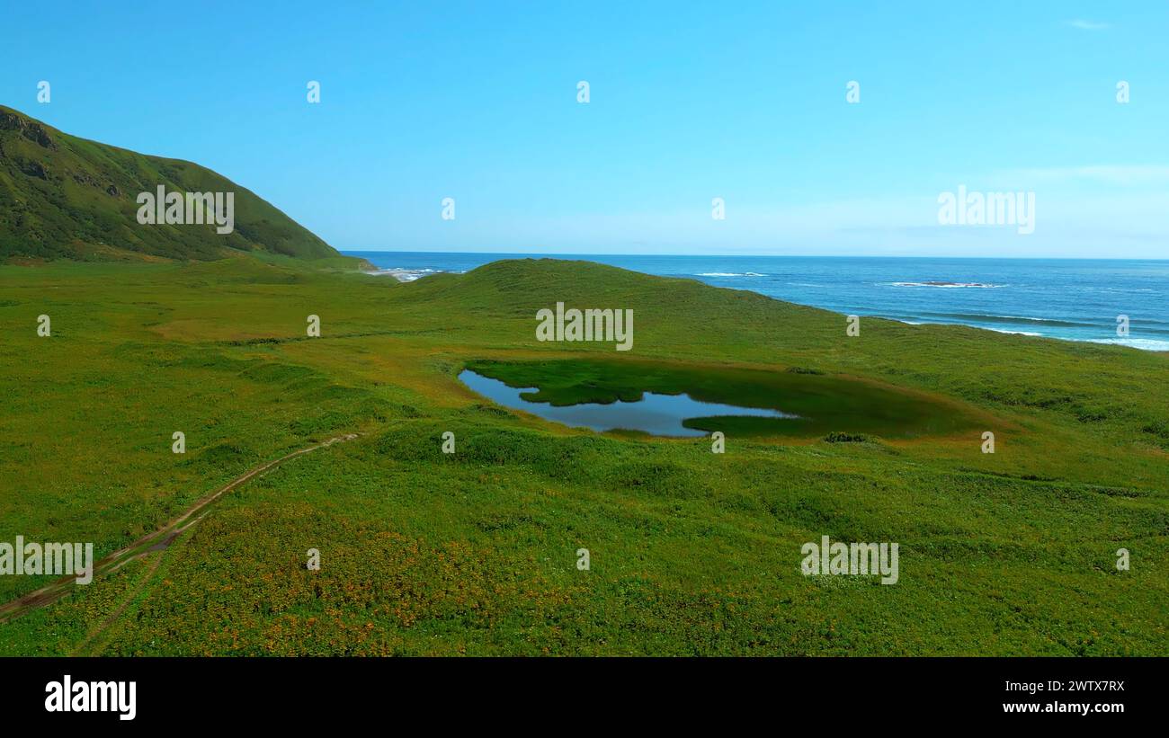 Rocky coastline alongside cliffside blue hi-res stock photography and ...