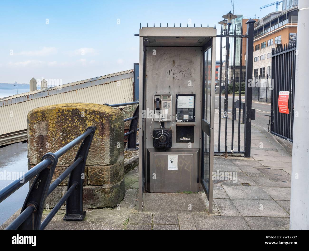 A coin-operated public telephone box by the quayside Liverpool, UK ...