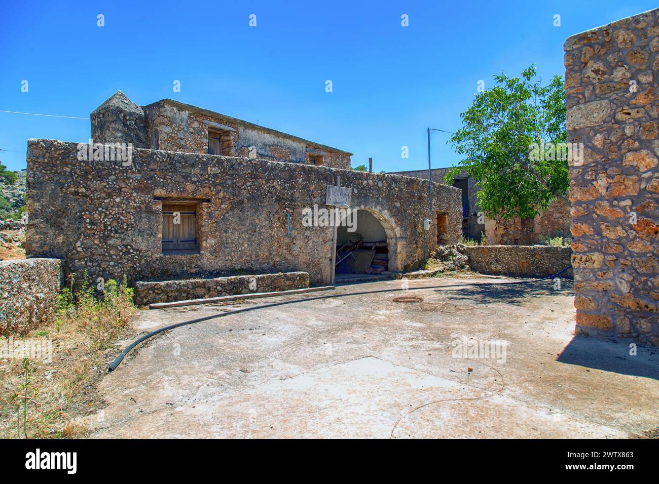 a house in the abandoned village of Ardana on the island of Crete ...