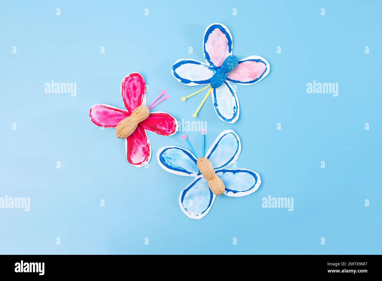 making paper craft butterflies, stamp, paint tubes, recycling concept ...