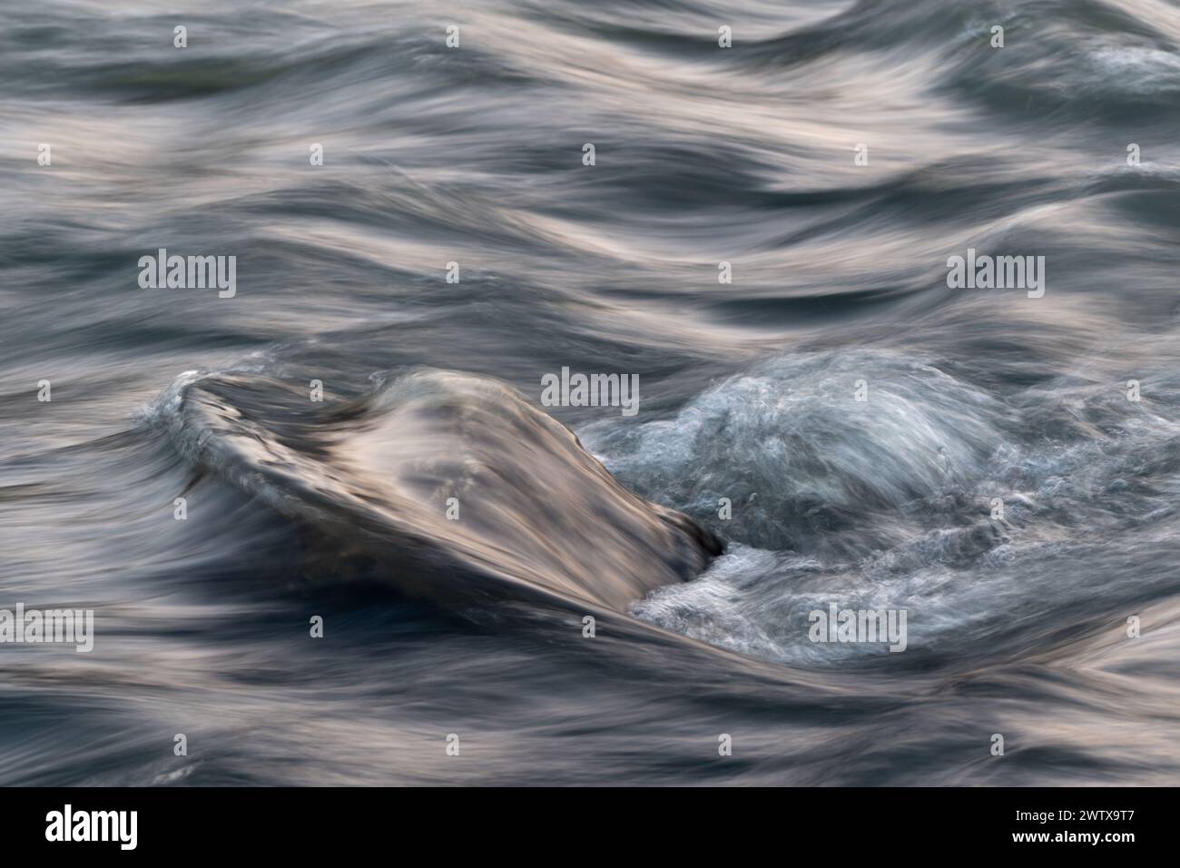 Water flow over stone, abstract landscape close up in long exposure ...