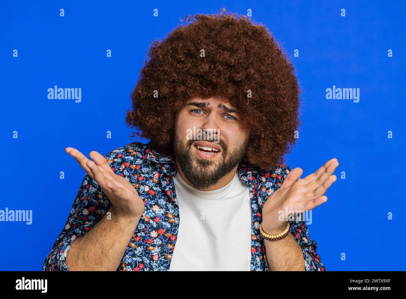 What. Why. Angry sad Caucasian man raising hands in indignant ...