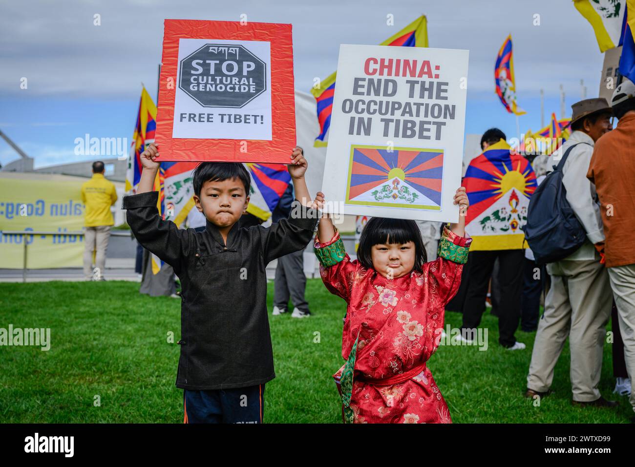 Two kids hold "Stop cultural genocide, free Tibet!" and "China: End the ...