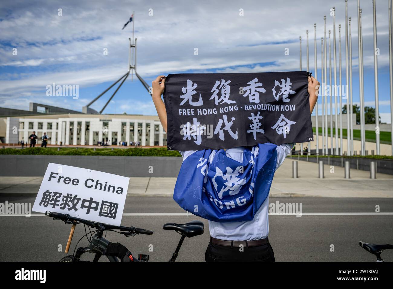 A protester holds a "Free Hong Kong revolution now" banner during the ...