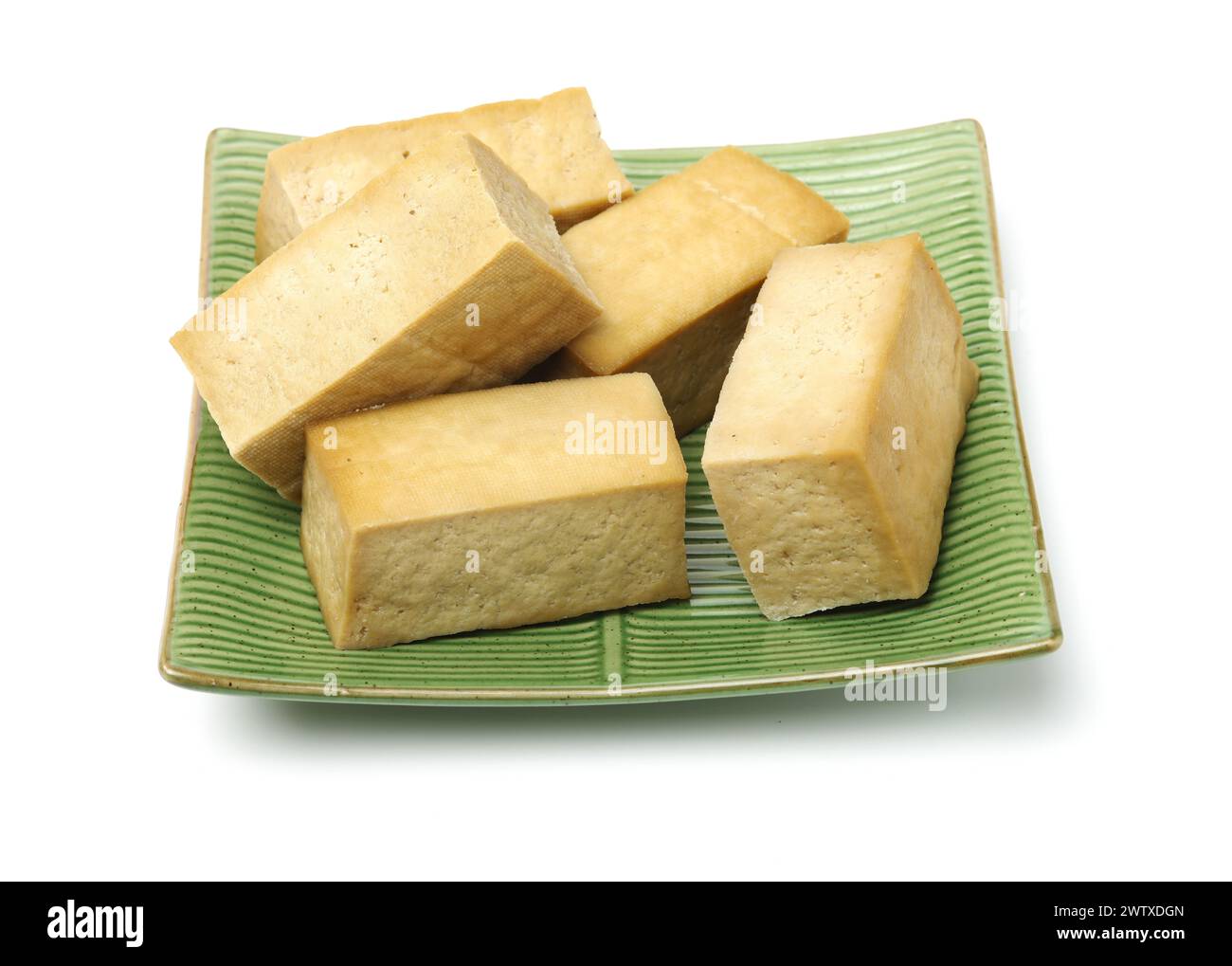 Dried bean curd on white background Stock Photo - Alamy