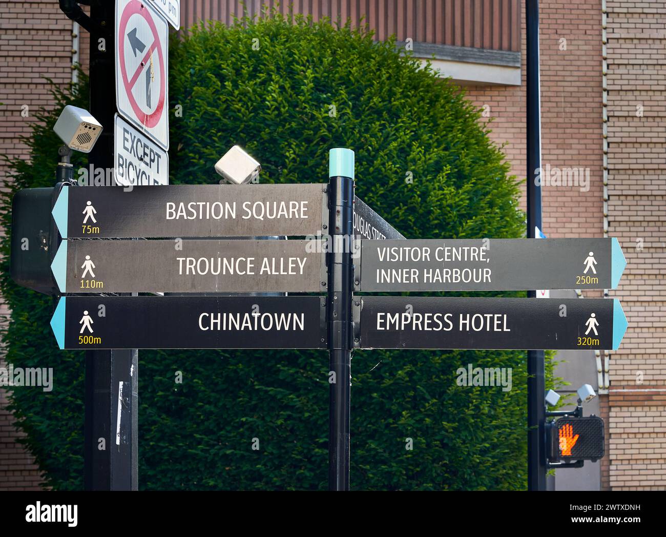 A street sign in Victoria pointing the direction and listing the ...