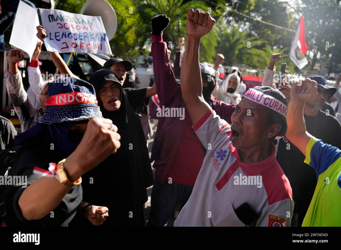 Protesters shout slogans during a rally alleging a widespread fraud in ...