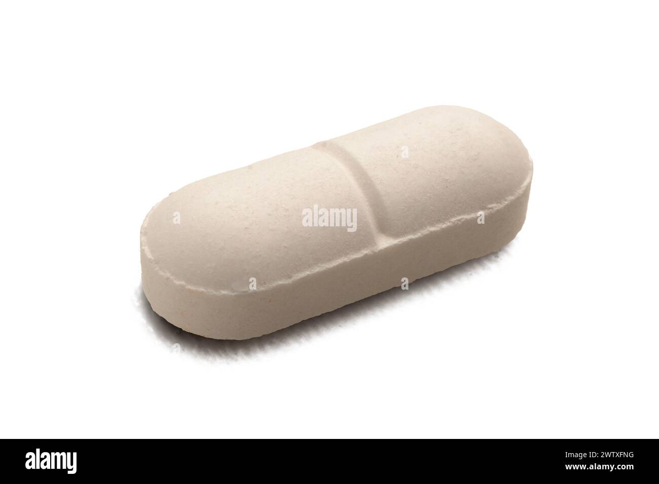Big white pill isolated with shadow Stock Photo - Alamy