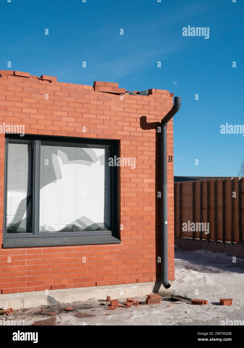Demolition of a red brick building Stock Photo - Alamy