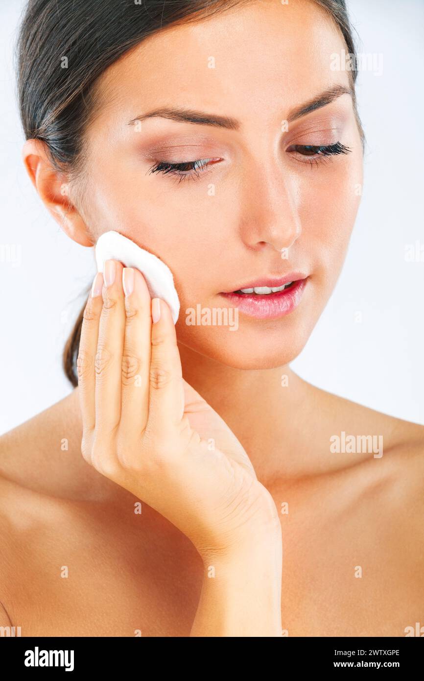 Face, woman and cotton pad for clean skin, makeup removal and skincare ...