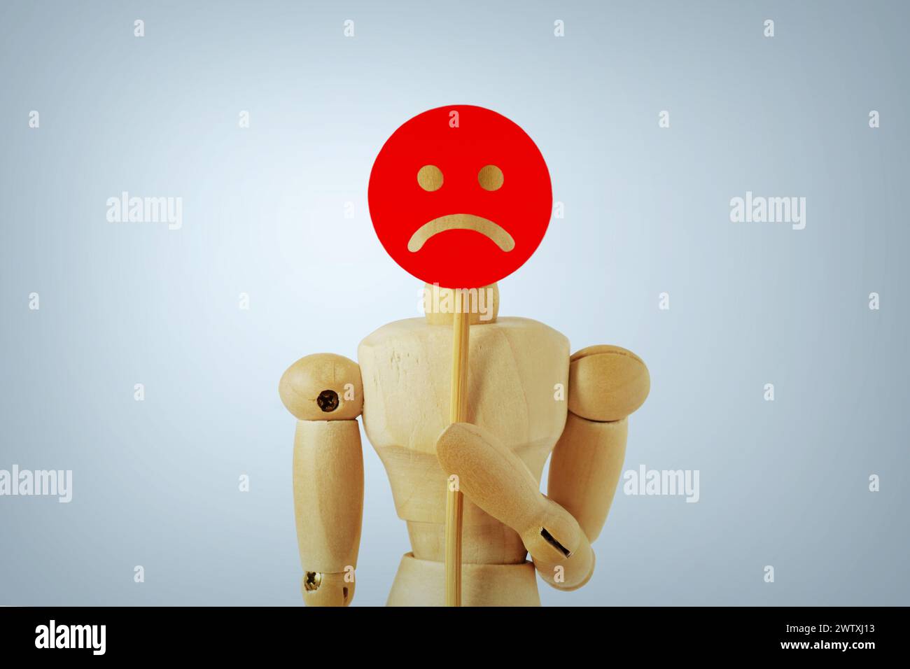 Wooden mannequin with sad face paddle - Concept of sadness ...