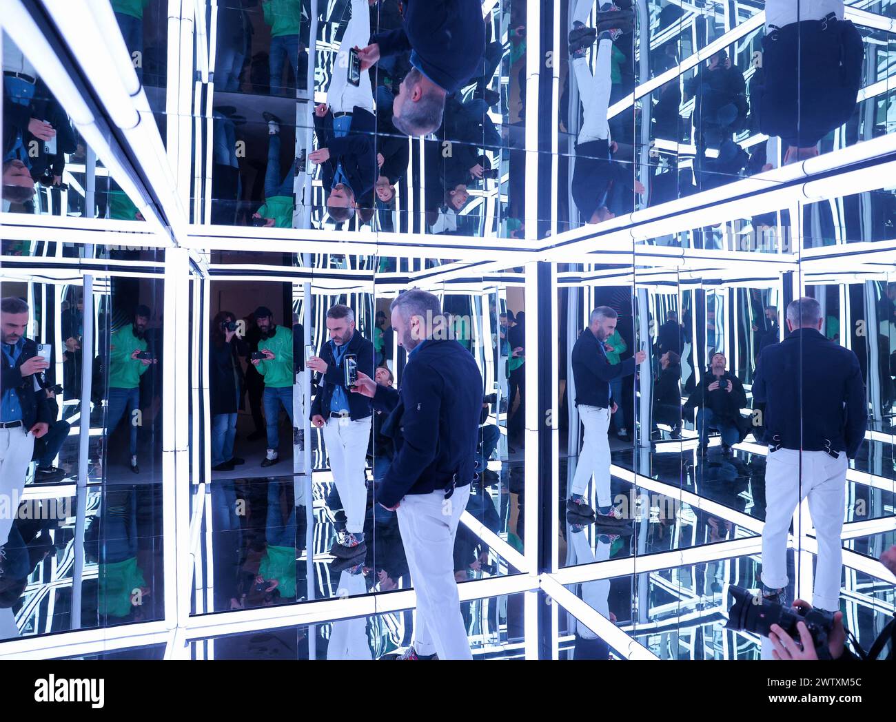 Several people look at one of the installations of the Museum of Light ...