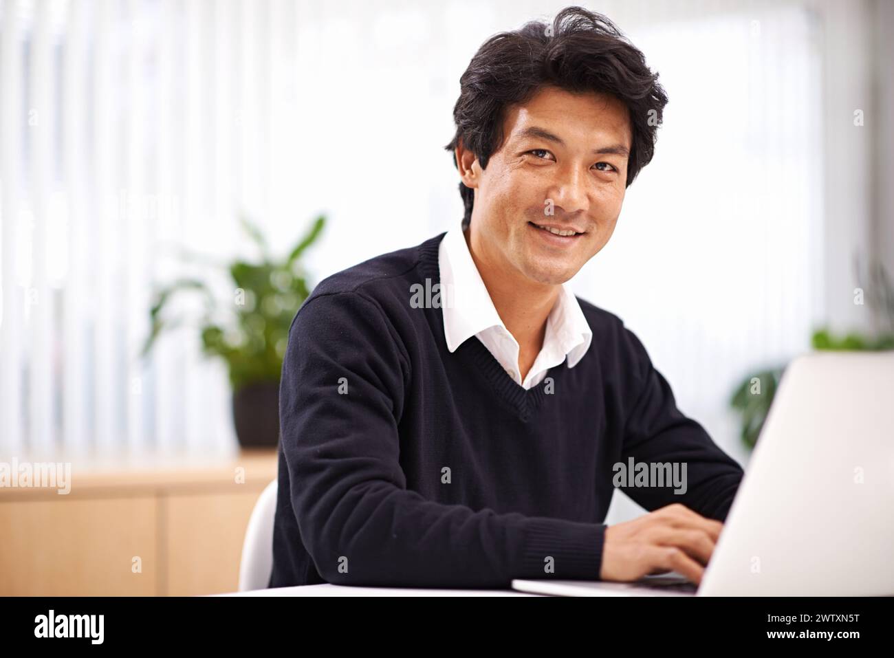 Portrait, laptop and professional asian business man in office for ...
