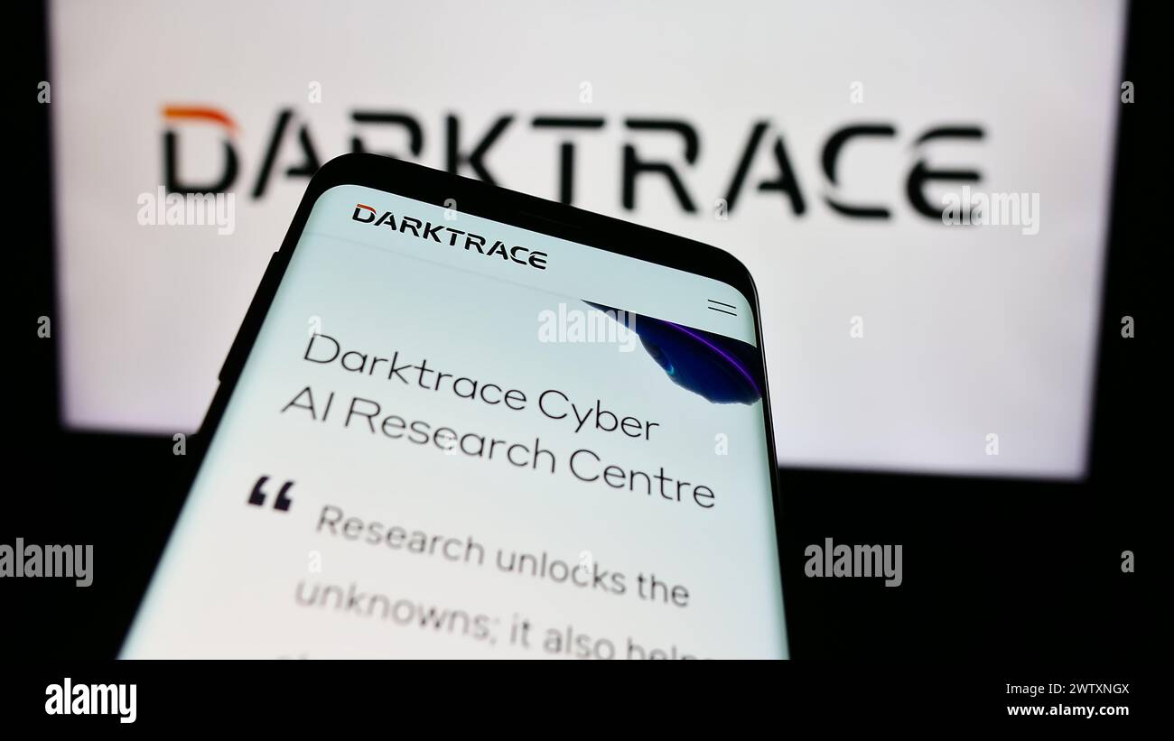 Mobile phone with website of British cyber security company Darktrace ...
