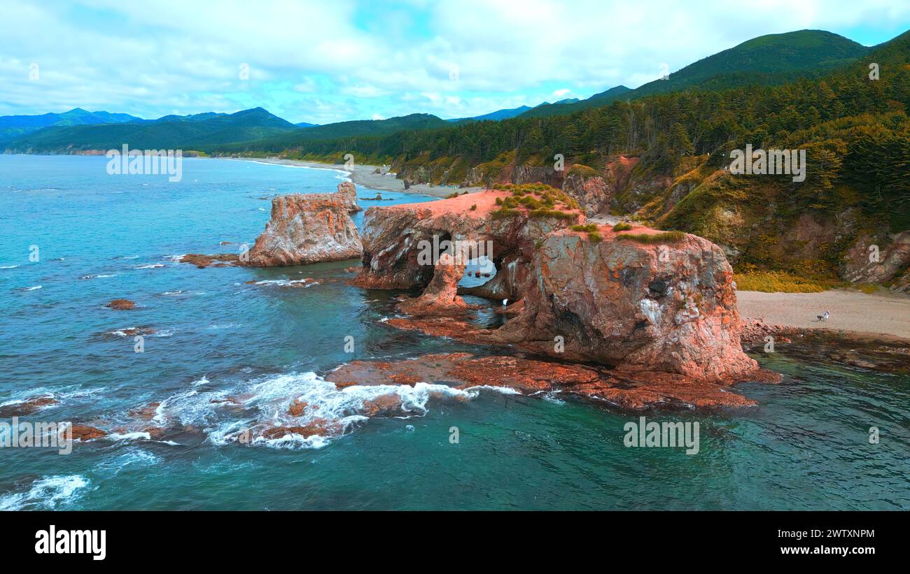 Top view of beautiful coast with rocky arches. Clip. Amazing nature of ...
