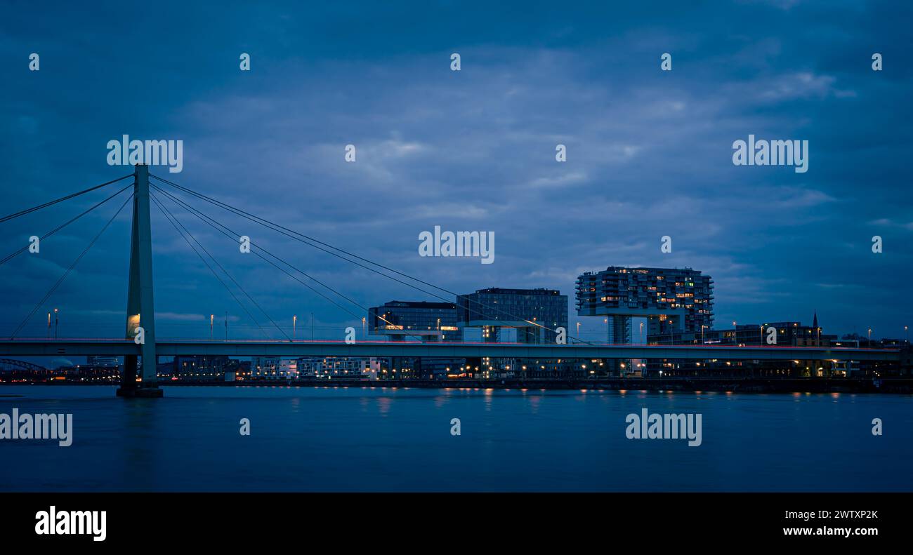 The Cologne's iconic waterfront towers shining under the evening sky ...