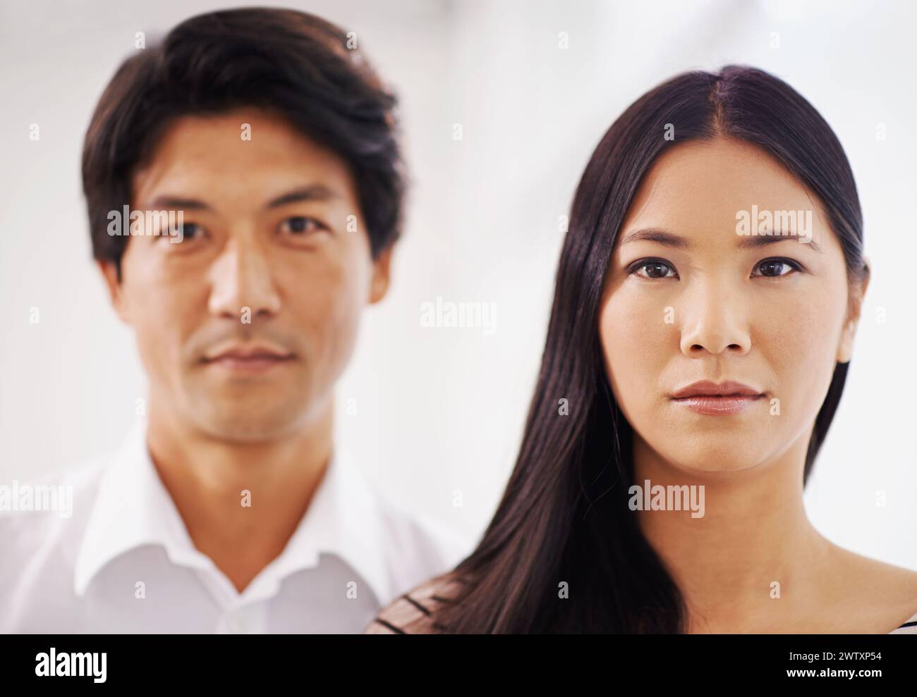 Portrait, woman and Asian man in office, serious and employees in ...
