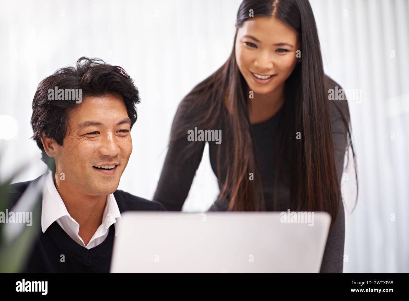 Happy, mentor and teamwork on laptop in office with businessman ...