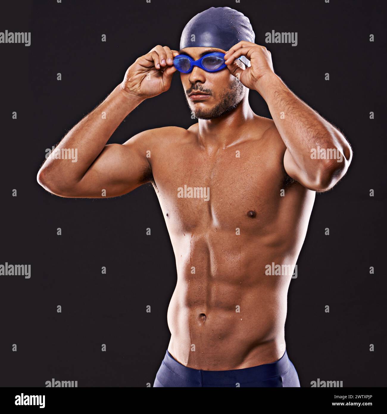 Studio, swimmer and man ready for competition, sport and training with ...