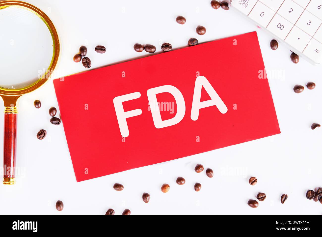 Health concept,FDA on a red card on a white background with scattered ...