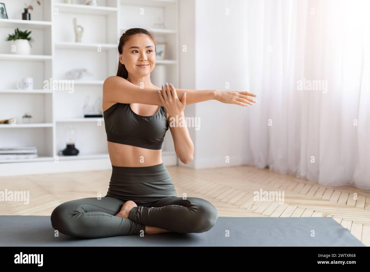 Happy woman performing yoga hi-res stock photography and images - Alamy