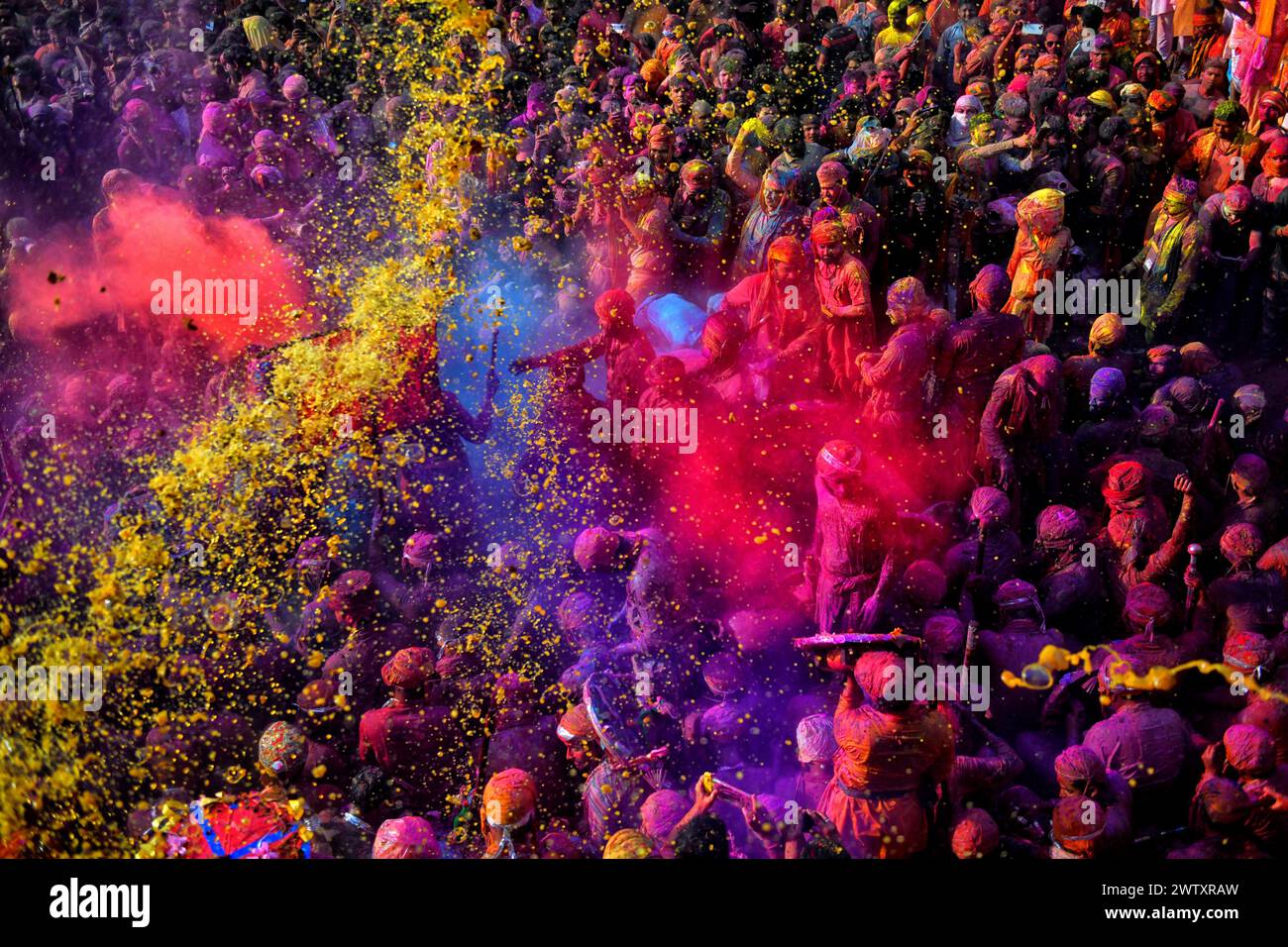 Mathura, India. 19th Mar, 2024. Hindu devotees play with colorful ...
