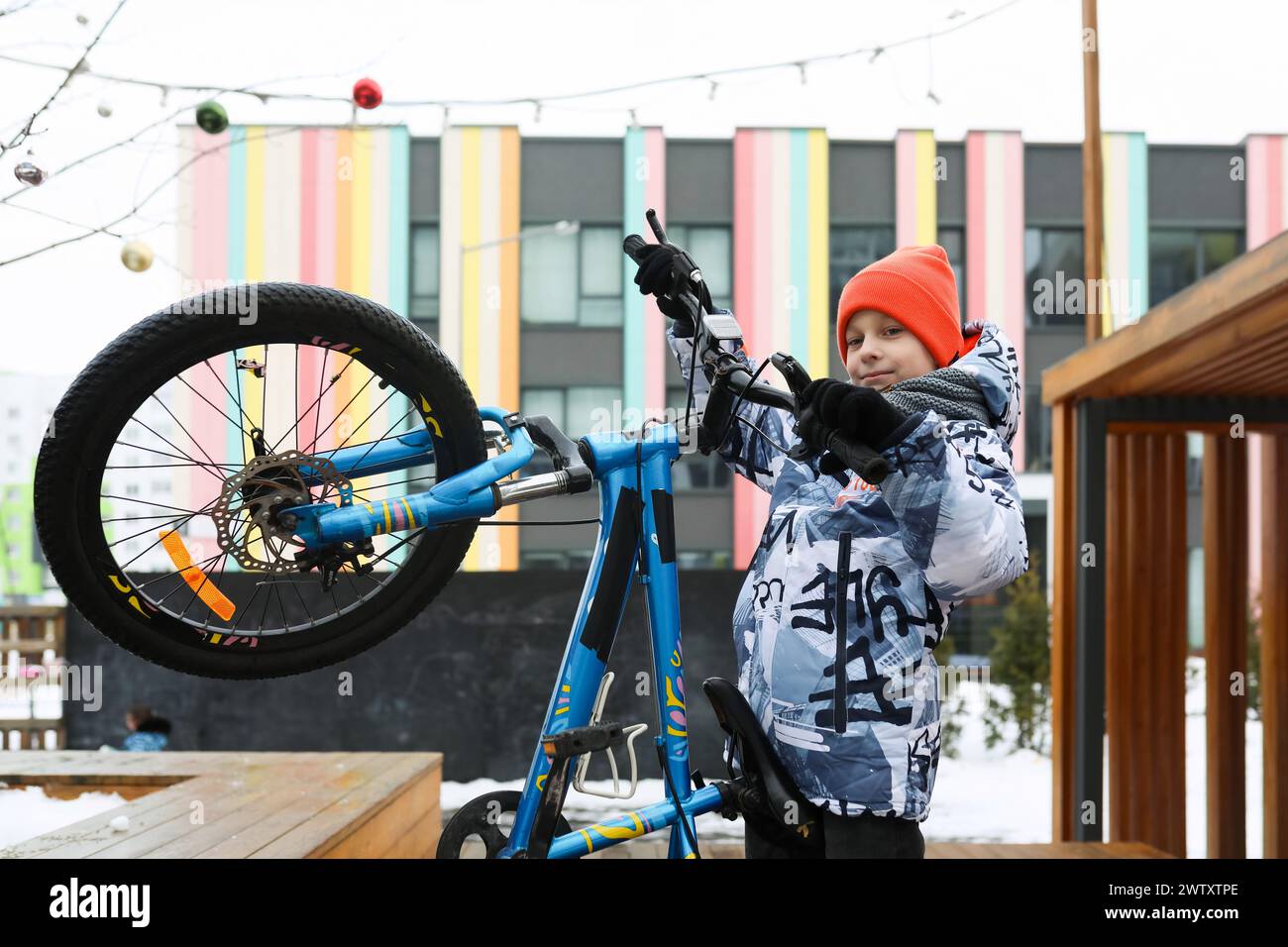 Cute boy got tired while riding a bike and sat down to rest Stock Photo ...
