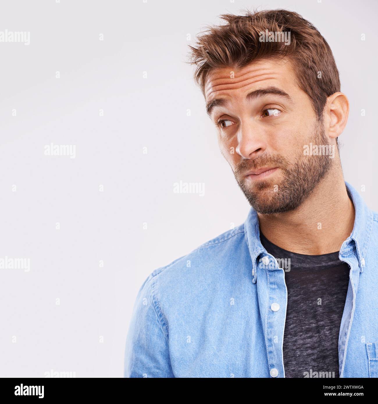 Thinking, confused or man with idea, doubt or stress on white studio ...