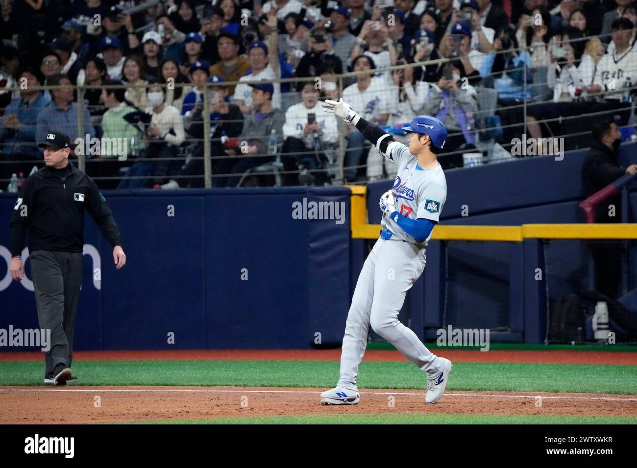 Los Angeles Dodgers designated hitter Shohei Ohtani gestures after ...